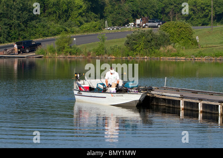 A fisherman getting his boat ready to castoff Stock Photo - Alamy
