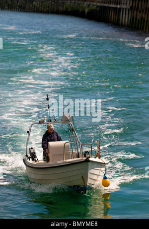 fishing boat entering Littlehampton harbour after a day at sea ...