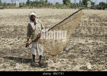 Fisherman with indigenous fishing net, used like a sieve Stock Photo ...