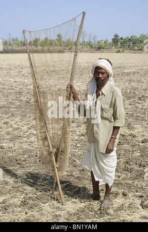 Fisherman with indigenous fishing net, used like a sieve Stock Photo ...