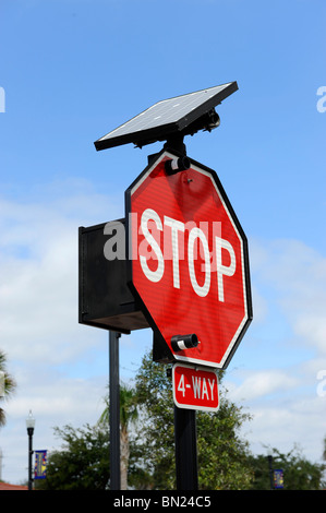Lighted stop sign powered by solar panel energy Stock Photo - Alamy