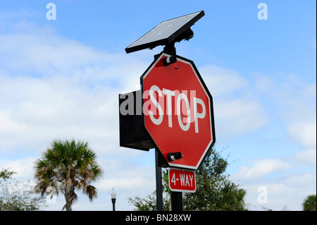 Lighted stop sign powered by solar panel energy Stock Photo - Alamy