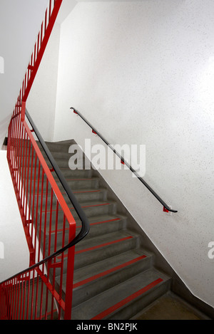 Red handrail in fire escape stair Stock Photo - Alamy