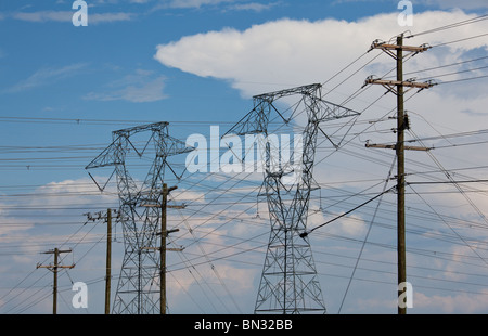 A line of electricity pylons march across the English countryside South ...