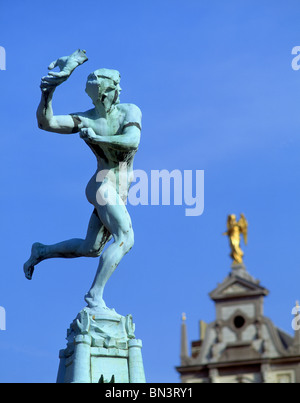 A vertical shot of a fountain with a statue on an old market square in ...