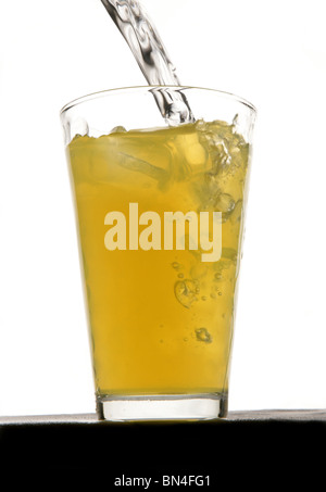 Orange squash drink with ice in studio Stock Photo - Alamy