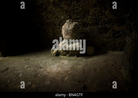 A Mayan God sculpture in lotus position is seen on a building at the ...