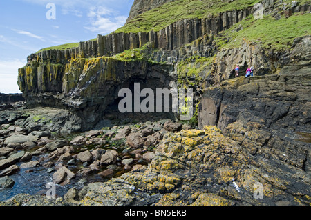 Walkers at one of the Carsaig Arches, Isle of Mull, Inner Hebrides ...
