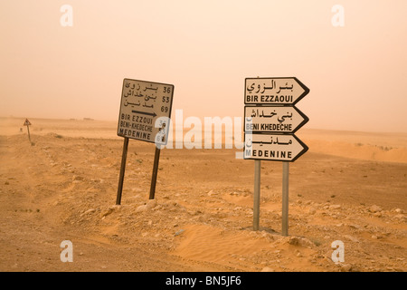 Road signs in the Sahara Desert are written with Arabic and Latin Stock ...