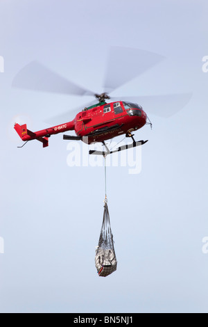 Helicopter carrying a load; Cornwall Stock Photo - Alamy