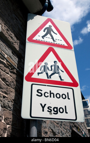 Bilingual sign school ysgol welsh English warning triangle sign Stock ...