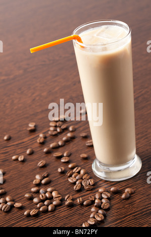 coffee ice in glass and coffee beans on a gray table, top view, copy ...