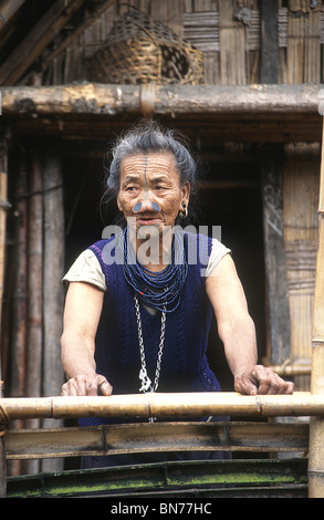 Apatani tribal woman with traditional yaping hullo (nose plugs) and ...