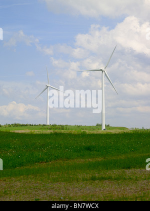 Windmill park with windmills turbines and a blue sky generating ...