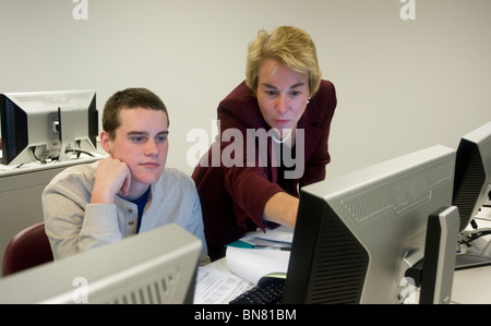 NY, NY, 2009 - college computer lab. professor, in red, showing ...