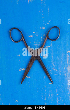 Open rusty barber's pair of scissors Stock Photo - Alamy
