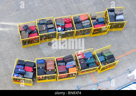 Suitcases being loaded onto a cruise ship by baggage handlers in ...