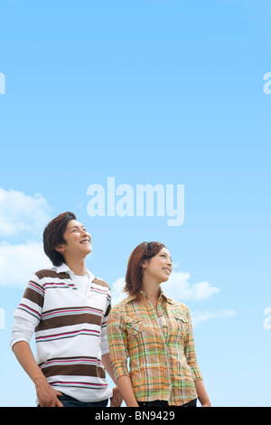 Young man, smiling, low angle view Stock Photo - Alamy