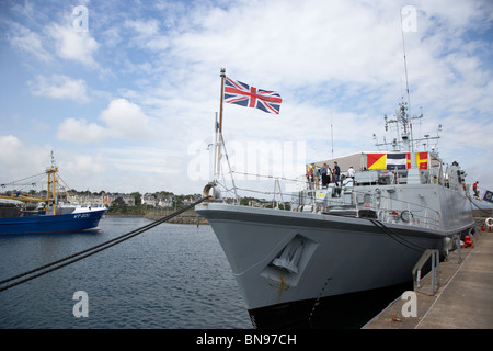 Navy ship flying the Union Jack with anchor Stock Photo - Alamy