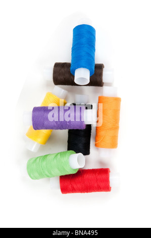 Set of colorful sewing threads on white background Stock Photo - Alamy
