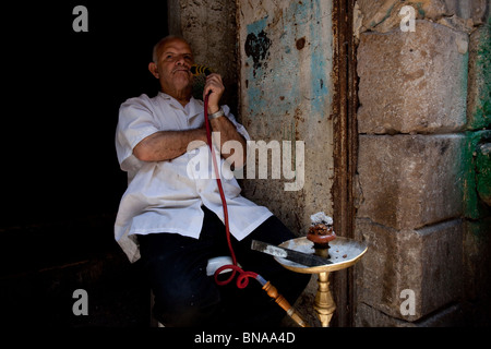 An Israeli Arab man smoking hookah pipe in Ajami a mixed Arab Jewish ...