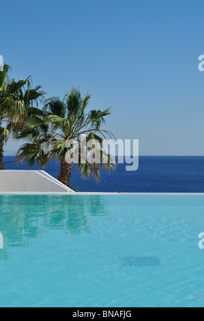 Mykonos. Greece. Infinity pool at Hotel Mykonos Blu, Psarou Beach Stock ...