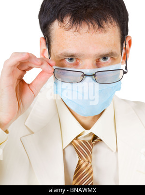 Handsome young doctor man over isolated background covering one eye ...