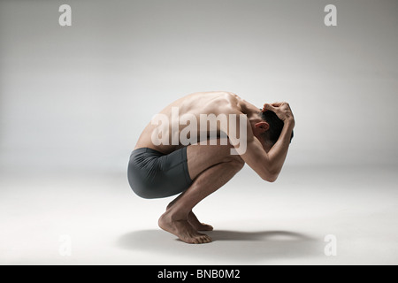Man Crouching Down Stock Photo - Alamy