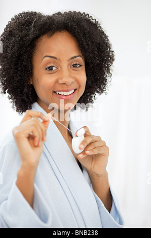 Smiling women use dental floss white healthy teeth Stock Photo - Alamy