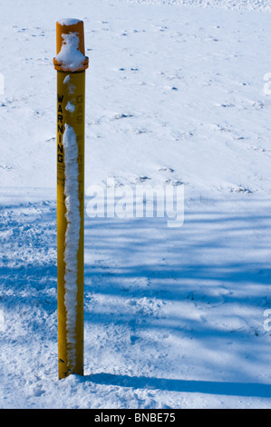 Snow covered natural gas line meter of building or home. High energy ...