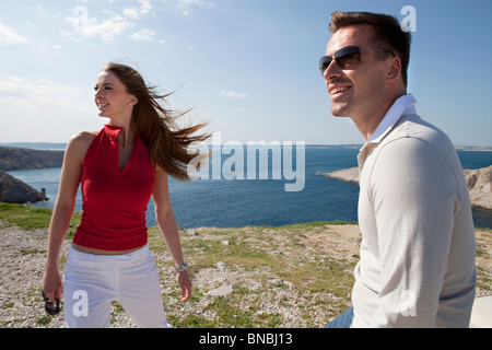 Young Couple Overlooking the Ocean Stock Photo - Alamy