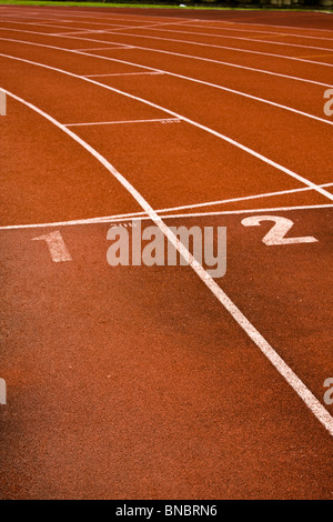 Numbers on track lanes in sports runway Stock Photo - Alamy