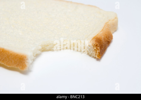 Piece of Bread with Bite taken out Stock Photo - Alamy