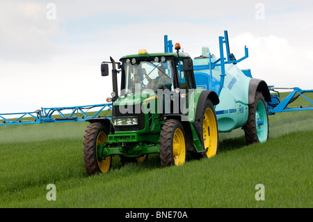 Farmer spraying spring barley crop with herbicide Stock Photo - Alamy