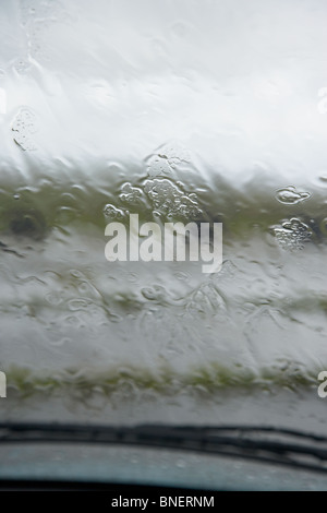 heavy rain on car windscreen wiper detail Stock Photo - Alamy
