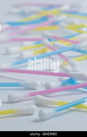 3 colorful plastic Q-tips / cotton buds on black Stock Photo - Alamy