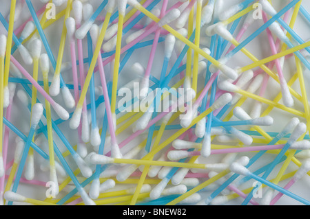 3 colorful plastic Q-tips / cotton buds on black Stock Photo - Alamy