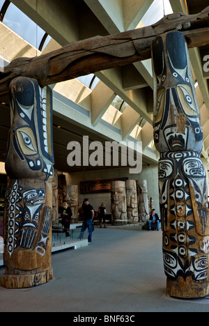 Elaborate carved cedar west coast Aboriginal First Nations totem poles ...