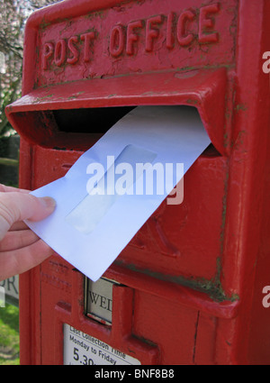 Woman posting letters Stock Photo - Alamy