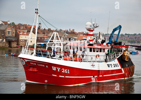 Trawler Our Lass leaving Whitby Harbour North Yorkshire England Stock ...