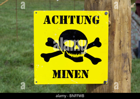 German land mines warning sign from World War Two, wet with water ...