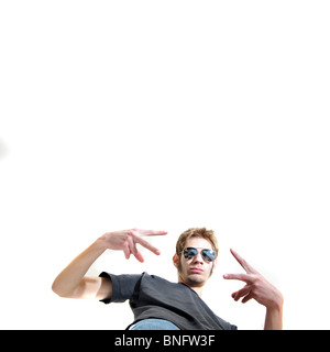 Gangsta with gun pointing down towards camera isolated on white ...