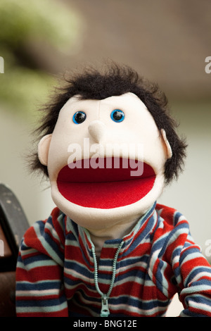 Dumbstruck spiky black hair puppet Stock Photo - Alamy