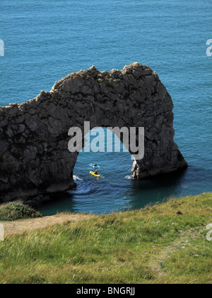 Kayaks in the sea at Durdle Door during the summer Dorset England UK ...