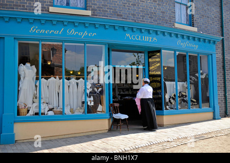 Old fashioned Victorian drapers shop with fabric and clothes on sale ...