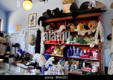 Old fashioned Victorian drapers shop with fabric and clothes on sale at ...