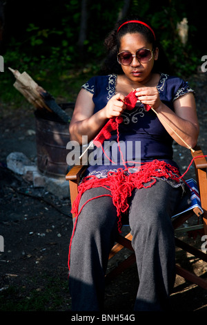 Woman knitting when camping in Kent Stock Photo - Alamy