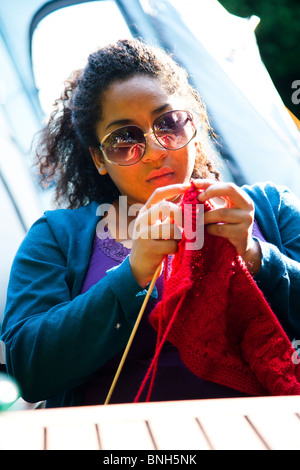 Woman knitting when camping in Kent Stock Photo - Alamy