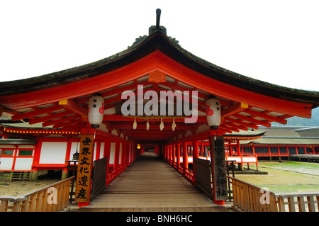 A sacred rice straw rope (shimenawa) marks the entrance to a Shinto ...