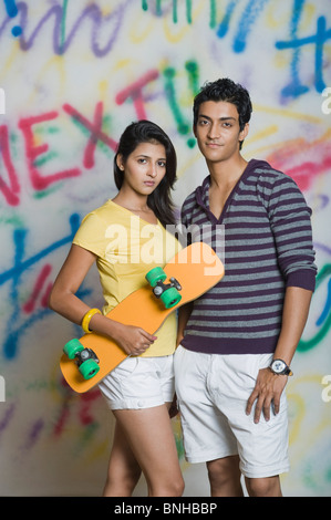 Portrait Of Two Female Friends With Skateboard In Urban Skate Park ...